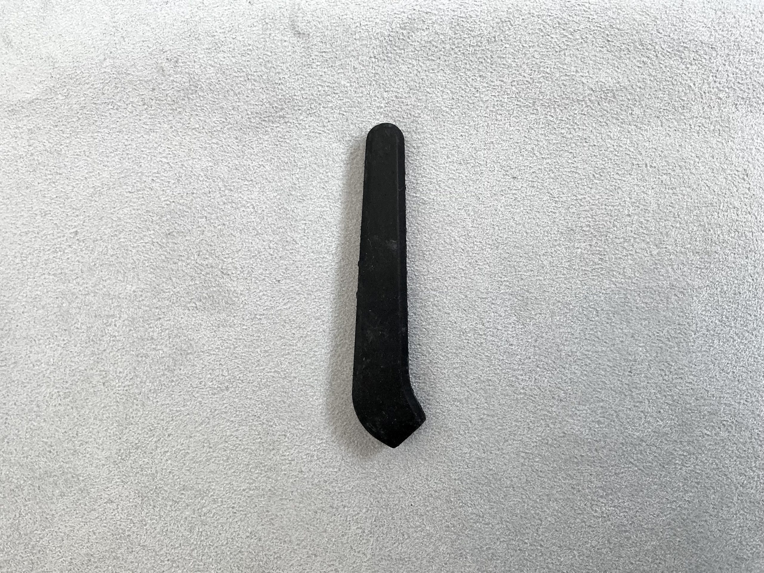 Rubber black dashboard lever extension.